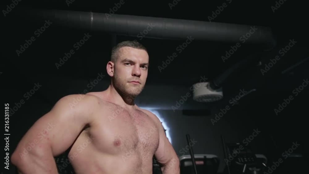 Strong, muscular man, Apollo shows his muscles, torso, vein Delta press ...