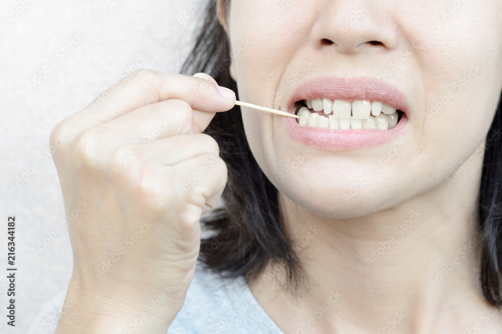 woman use wooden toothpick Stock Photo | Adobe Stock