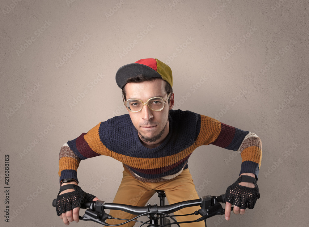 Nerd young foolish biker on a bike with oldschool outfit Stock Photo ...