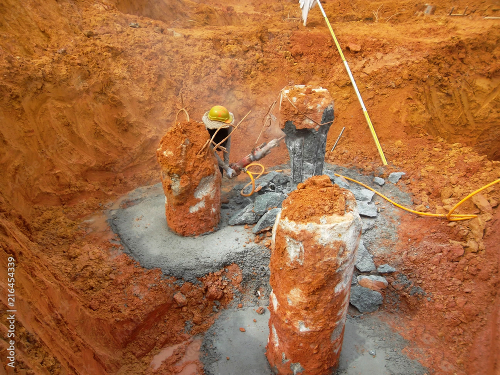 Bore pile cut to level by the construction workers. It will continue by ...