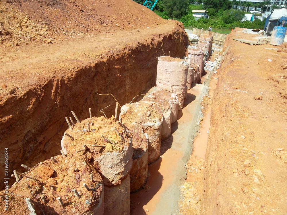 Bore pile cut to level by the construction workers. It will continue by ...