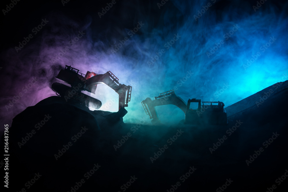 Construction site on a city street. A yellow digger excavator parked ...