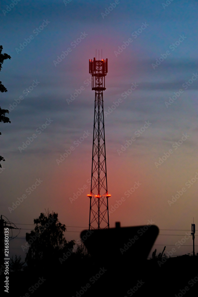 Communication Towers with Antennas. the telephone tower at night shines ...