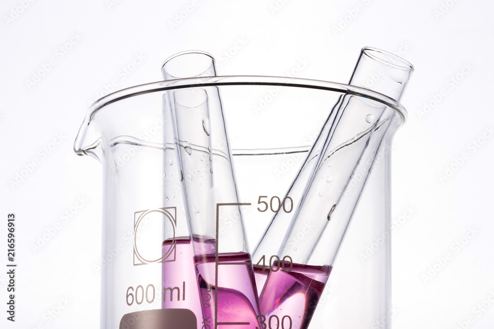 Foto de beaker and cylinder closeup isolated white. do Stock | Adobe Stock