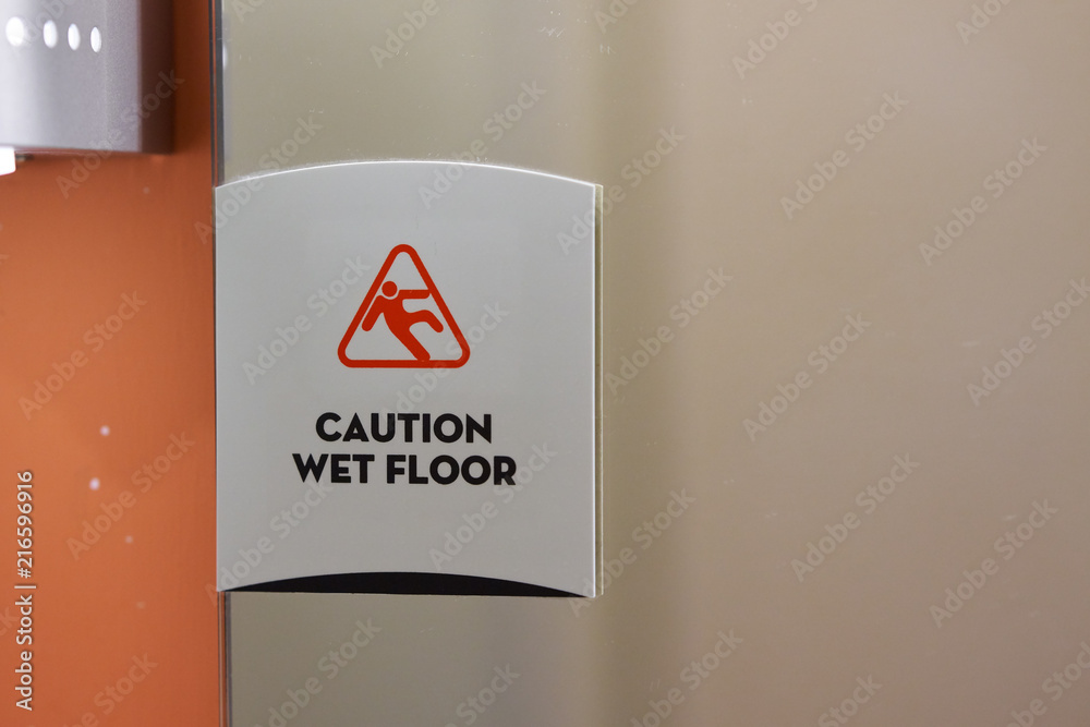 Caution wet floor safety text and sign plaque. Slip and fall hazards ...