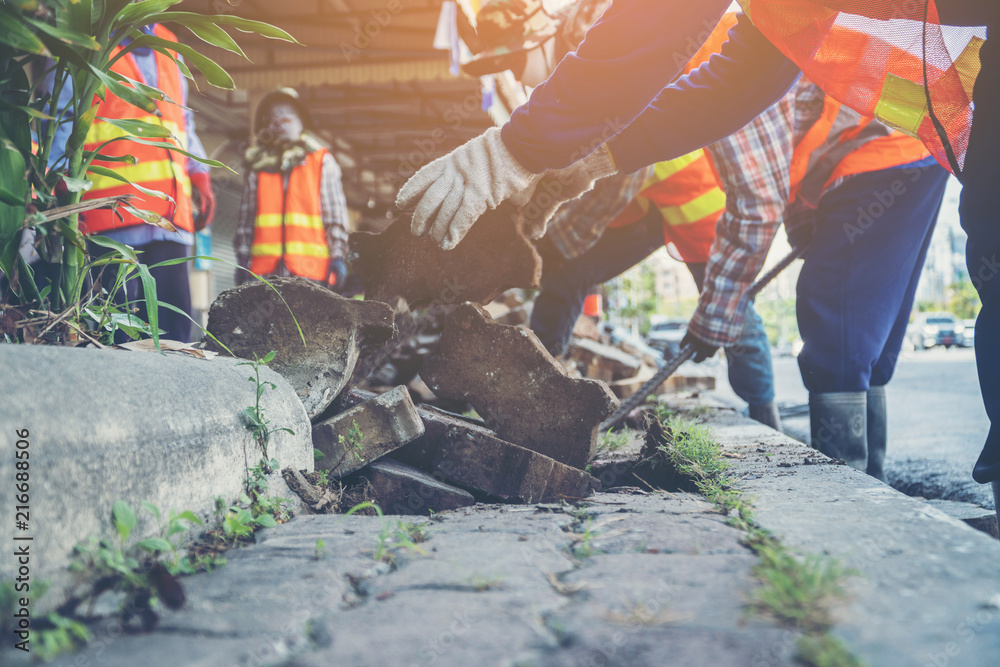 labors are constructing pedestrian walkways; workers building and ...
