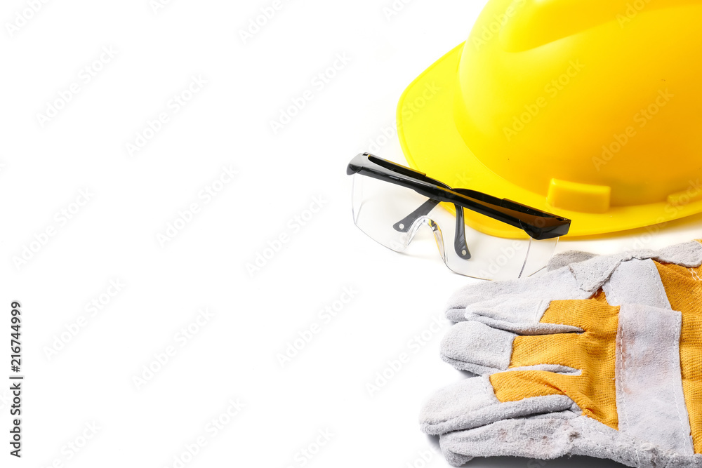 Construction site safety. Personal protective equipment on white ...