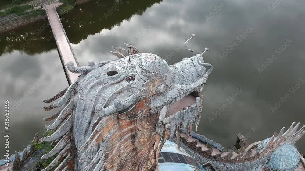 Circling around a giant dragon monument in an abandoned waterpark. Hue ...