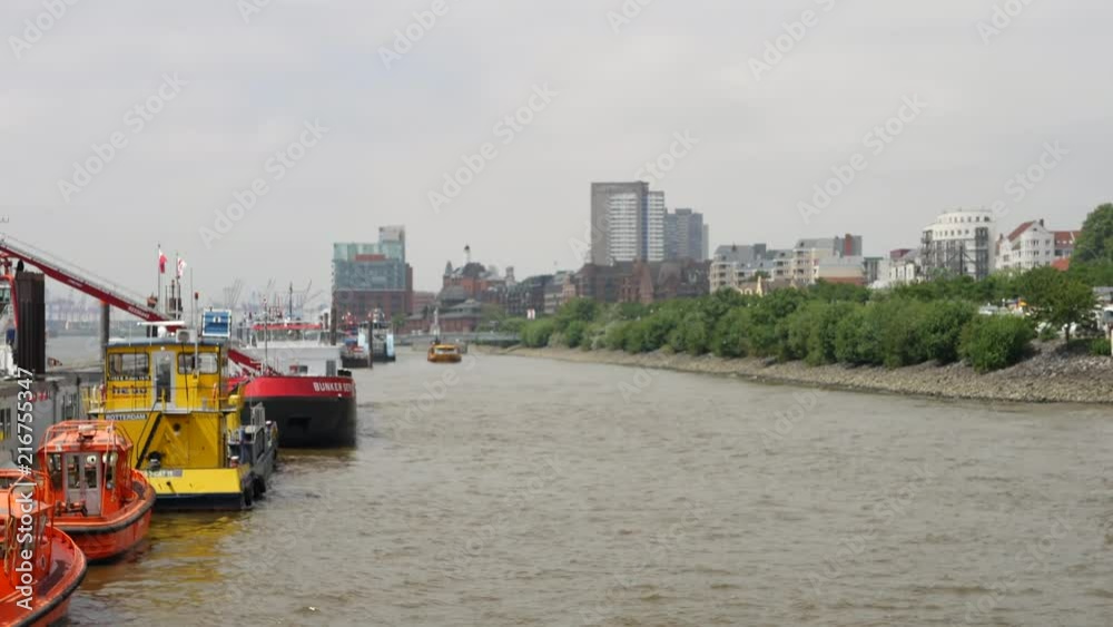 Yellow launch boat is cruising at Port of Hamburg at daylight with ...