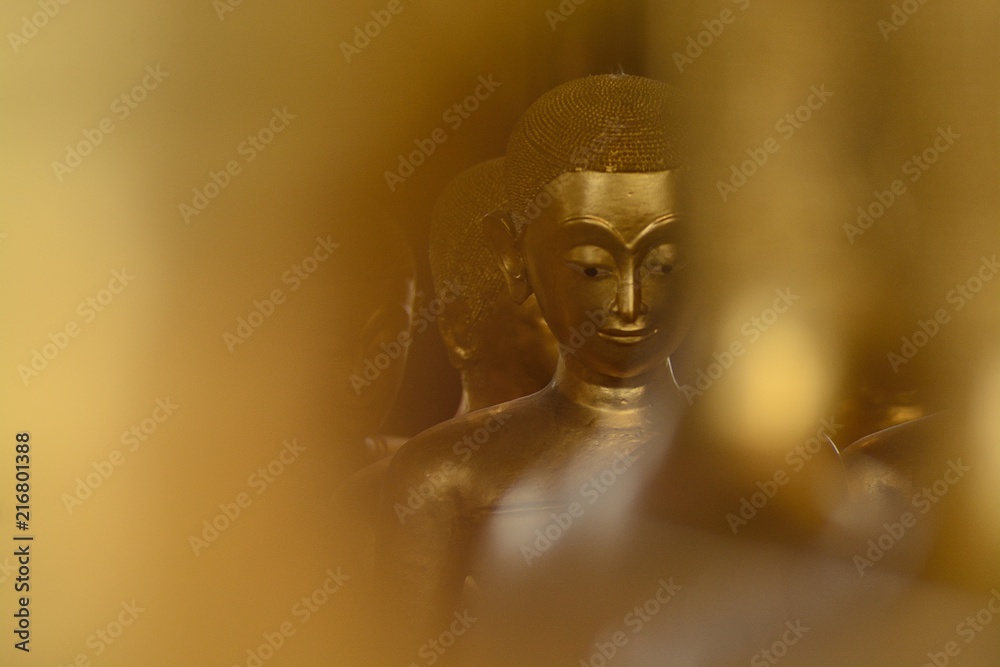 Ordained female monks or Bhikkunis surround Buddha's sculpture.These ...