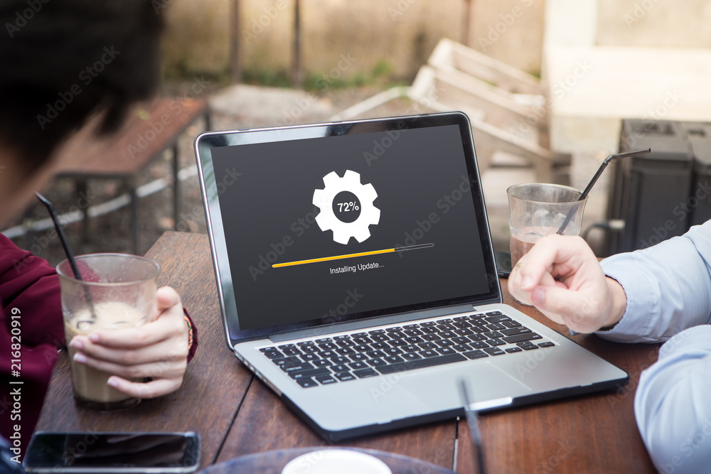 Group of young people having discussion and waiting for installing ...