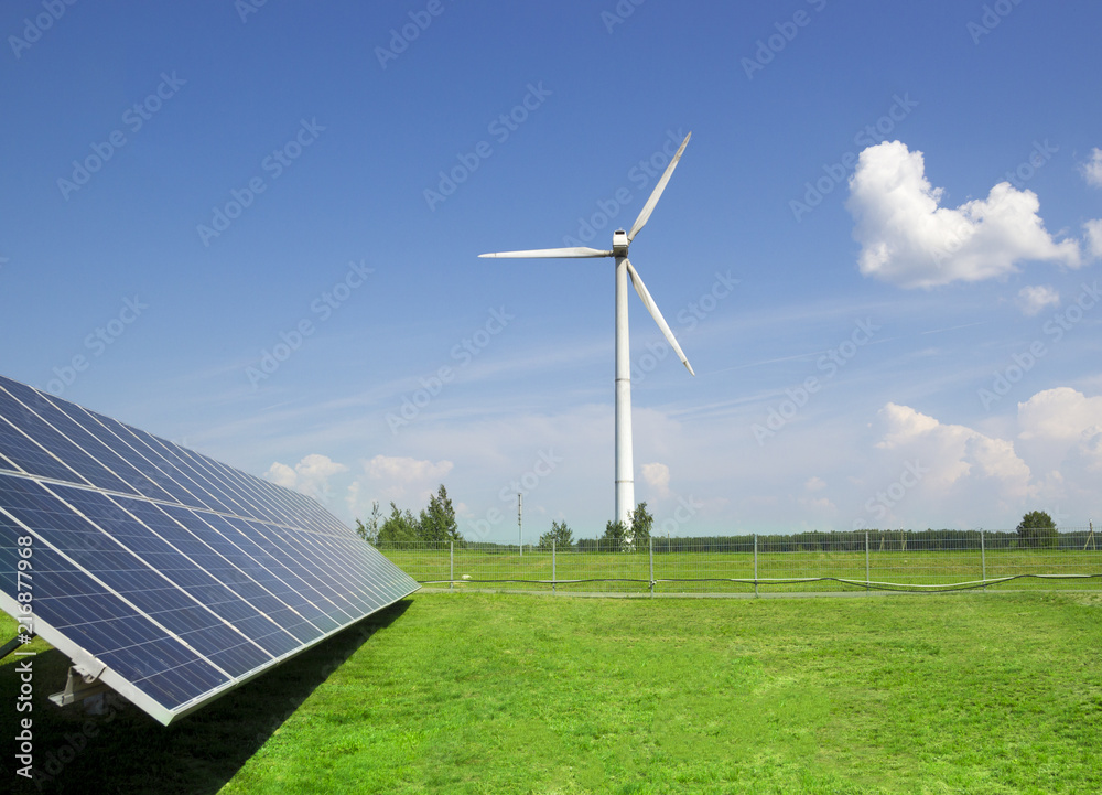 wind generator of electricity from three blades and solar panels of a ...