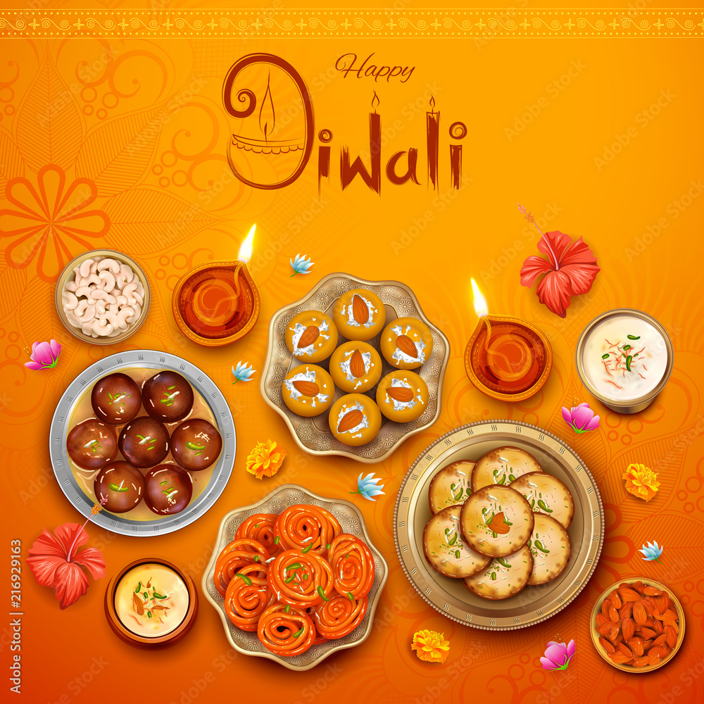 Burning diya with assorted sweet and snack on Happy Diwali Holiday ...