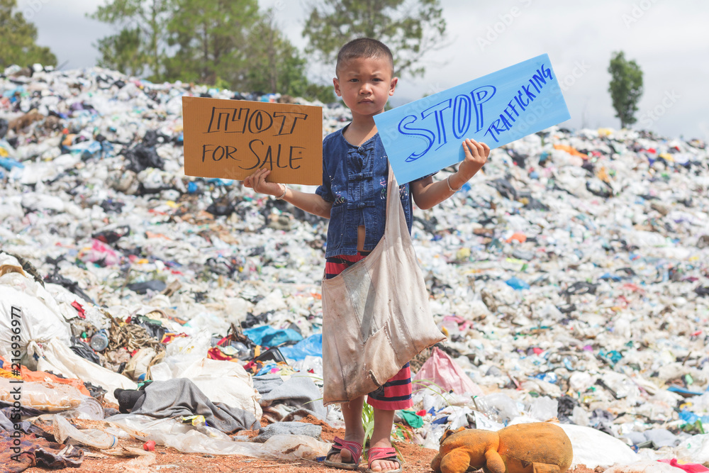 Standing child holding a sign, anti-trafficking, stopping violent acts ...