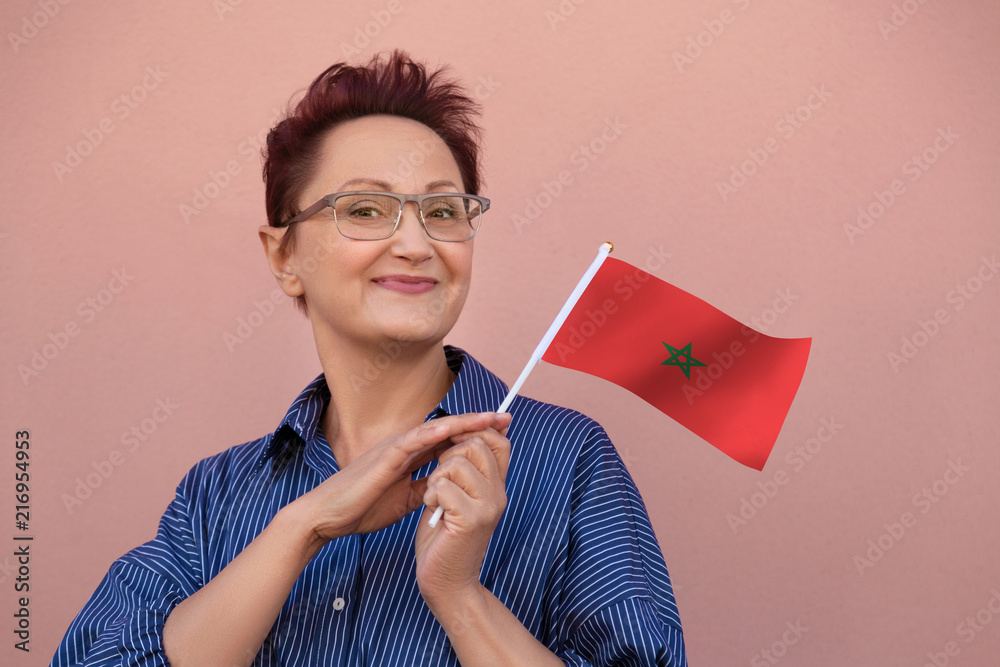 Morocco flag. Woman holding Moroccan flag. Nice portrait of middle aged ...