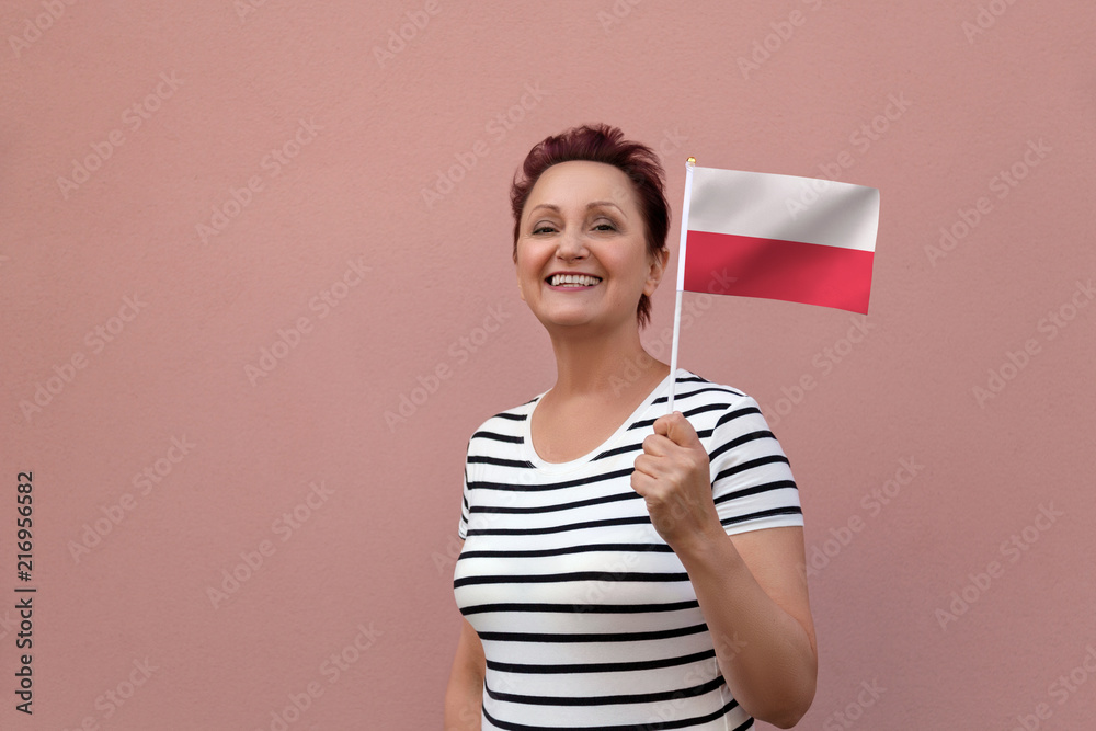 Poland flag. Woman holding Polish flag. Nice portrait of middle aged ...