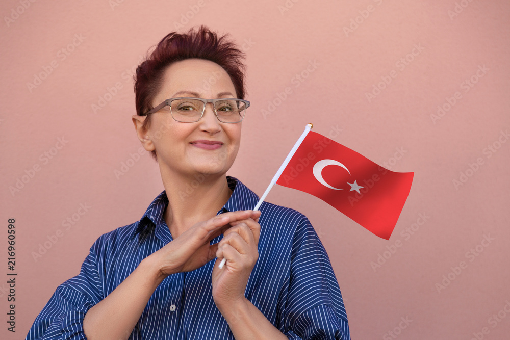 Turkey flag. Woman holding Turkish flag. Nice portrait of middle aged ...