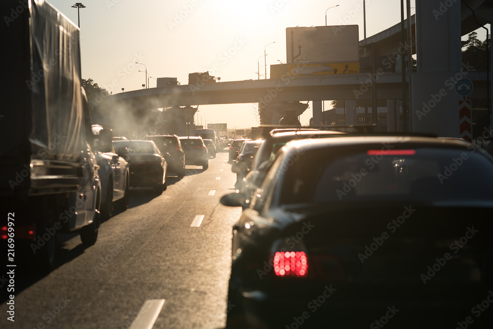 Traffic jam on a hot summer evening. Highway and road junction. Sunset ...