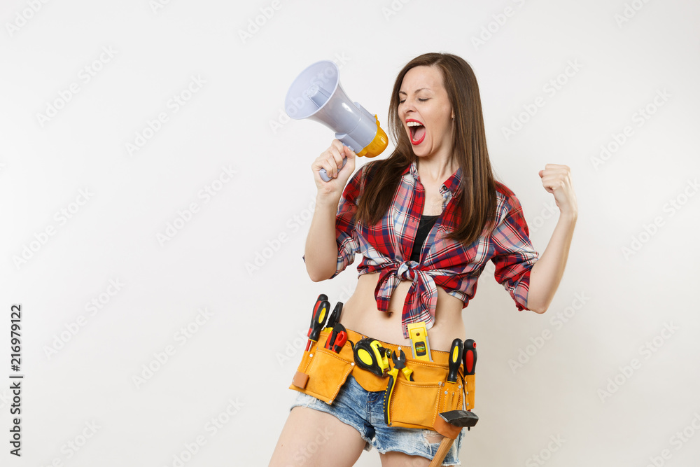 Young excited handyman woman in plaid shirt, denim shorts, kit tools ...