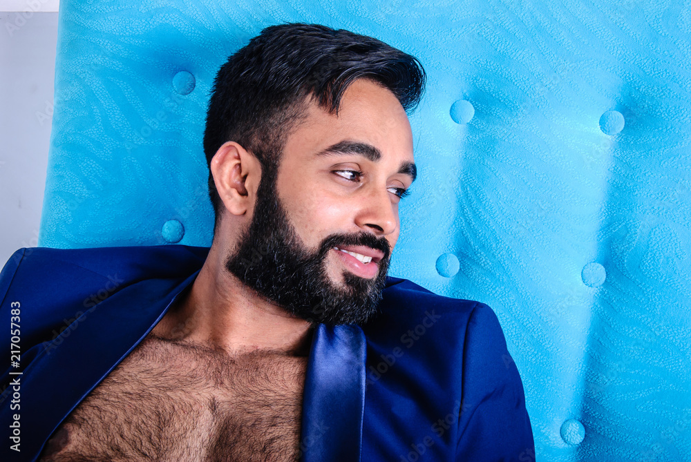 Headshot of handsome shirtless smiling young Asian man in blue suit ...