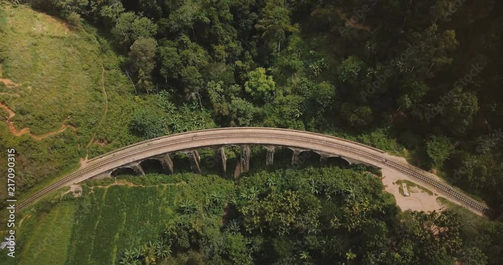 Drone lockdown top view of people walking over Nine Arch Bridge Ella in ...