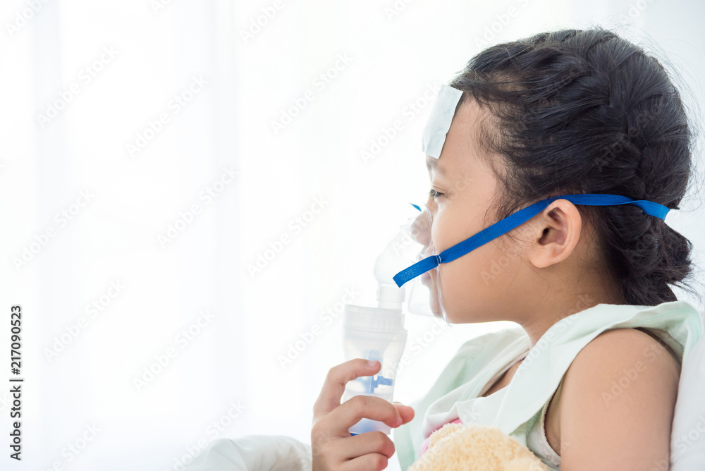 Young asian sick girl sitting on bed with oxygen mask Stock Photo ...