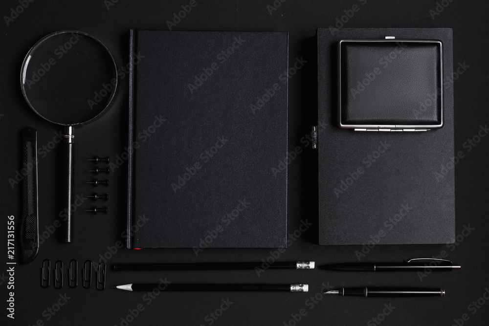 Set of black identity elements on black paper background. Black ...