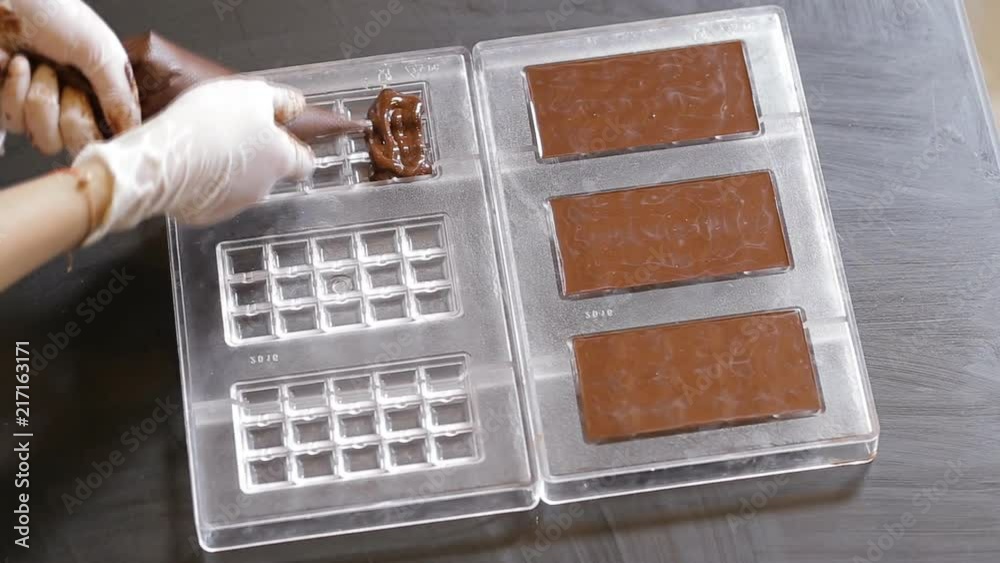 Preparation of dark chocolate bars made from scratch using cocoa butter ...