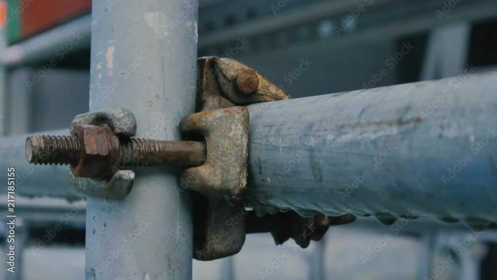 Scaffold joint, close-up, rusty bolt. Stock ビデオ | Adobe Stock