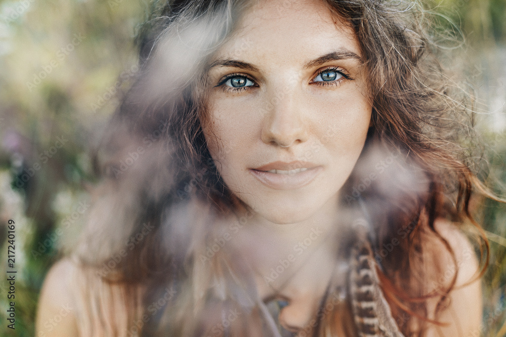 beautiful young boho styled woman on a field at sunset Stock Photo ...