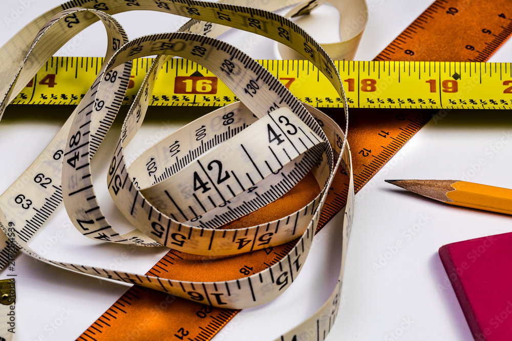 a macro image of Various measuring tools on a white background with a ...