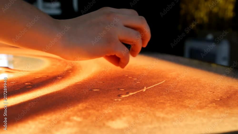 Drawing with sand. Drawing sand on a screen. Sand Artist. Hands draws ...