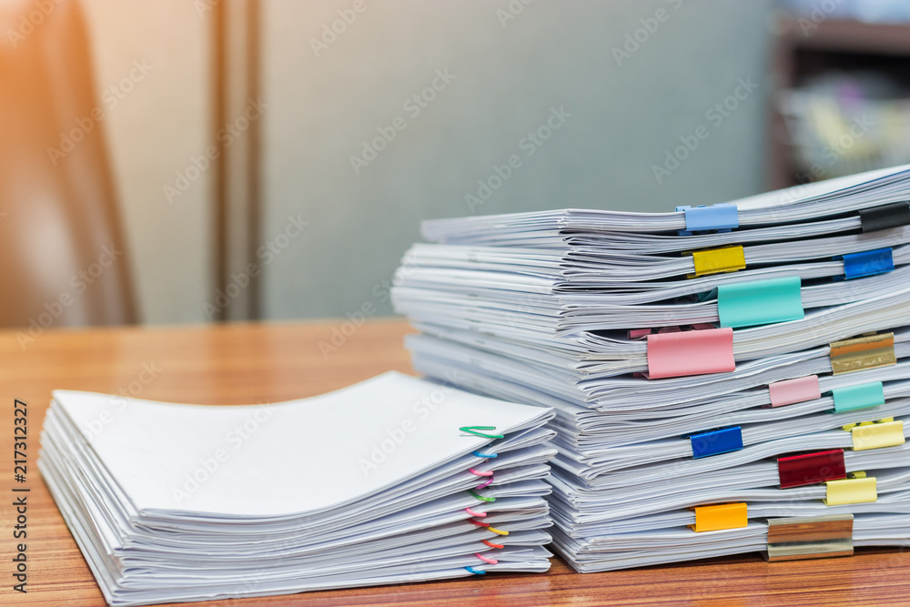Stack of student's homework that assigned to students to be completed ...