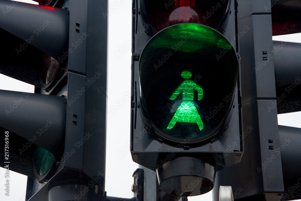 The silhouette of a woman in a traffic light as a sign of gender ...