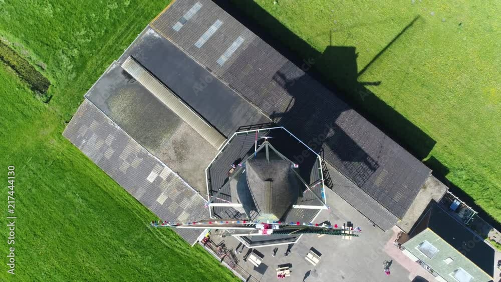 Aerial top down view of operational Dutch vintage windmill showing the ...