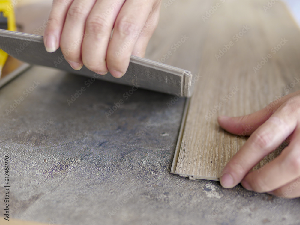 DIY vinyl sheet hand installation for flooring renovate work Stock ...