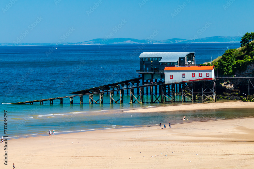 The main beach and lifeboat stations at the ancient West Wales walled ...