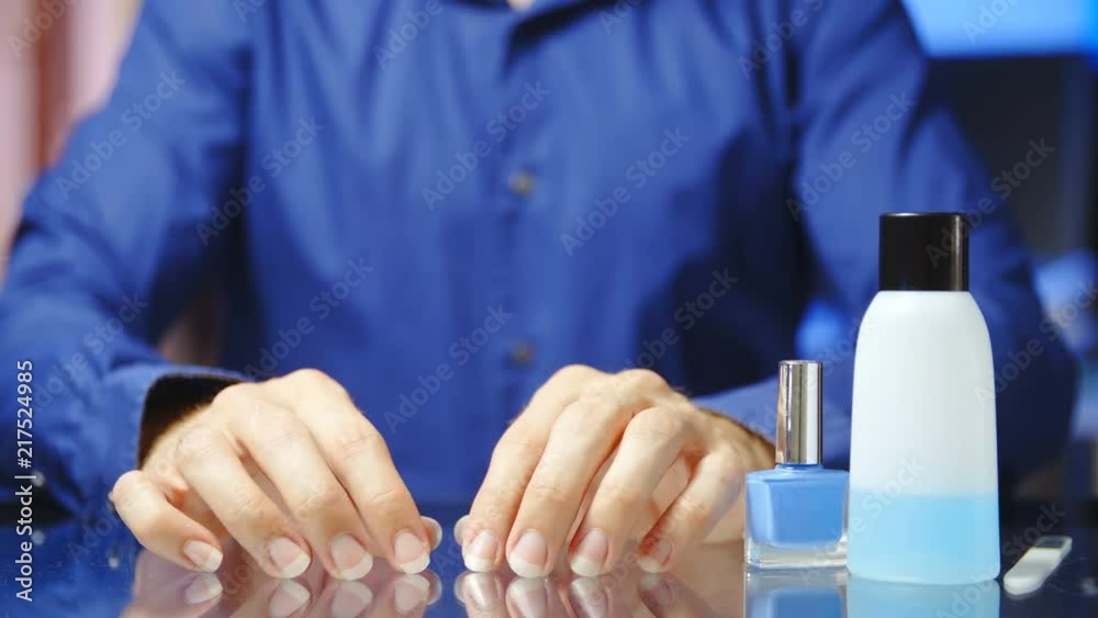 Man in blue shirt with long manicured nails getting ready for polish 4K ...