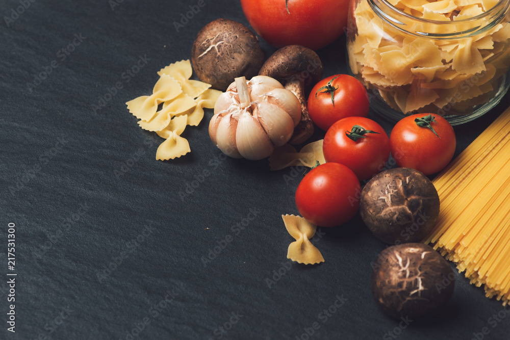 Italian food concept. Pasta ingredients. Cherry-tomatoes, spaghetti ...