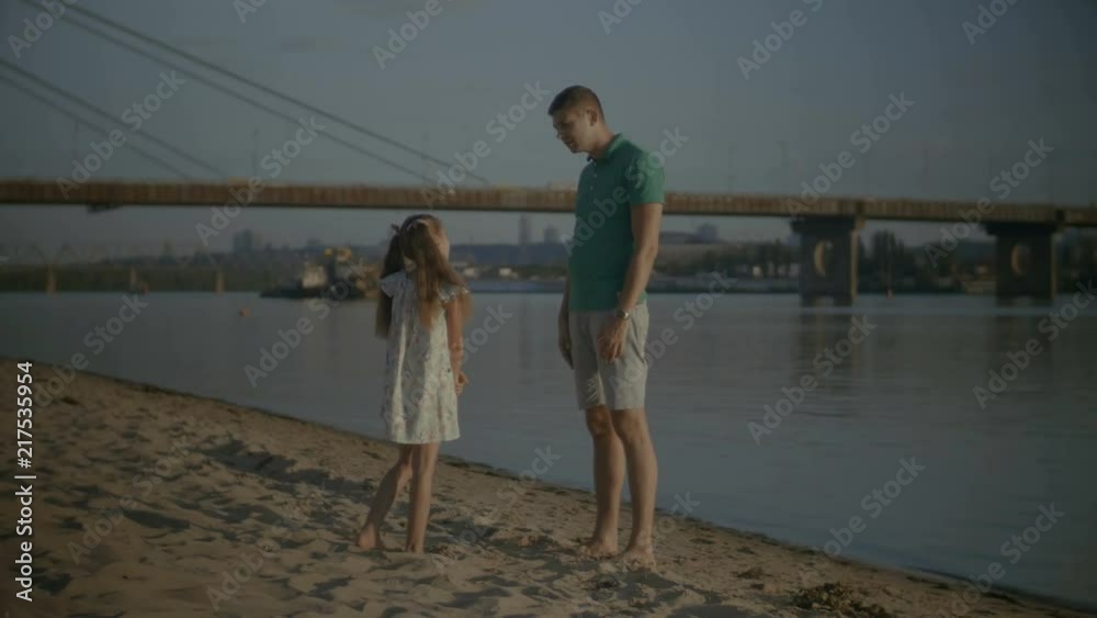 Distraught father quarrelling with his cute little daughter on the ...