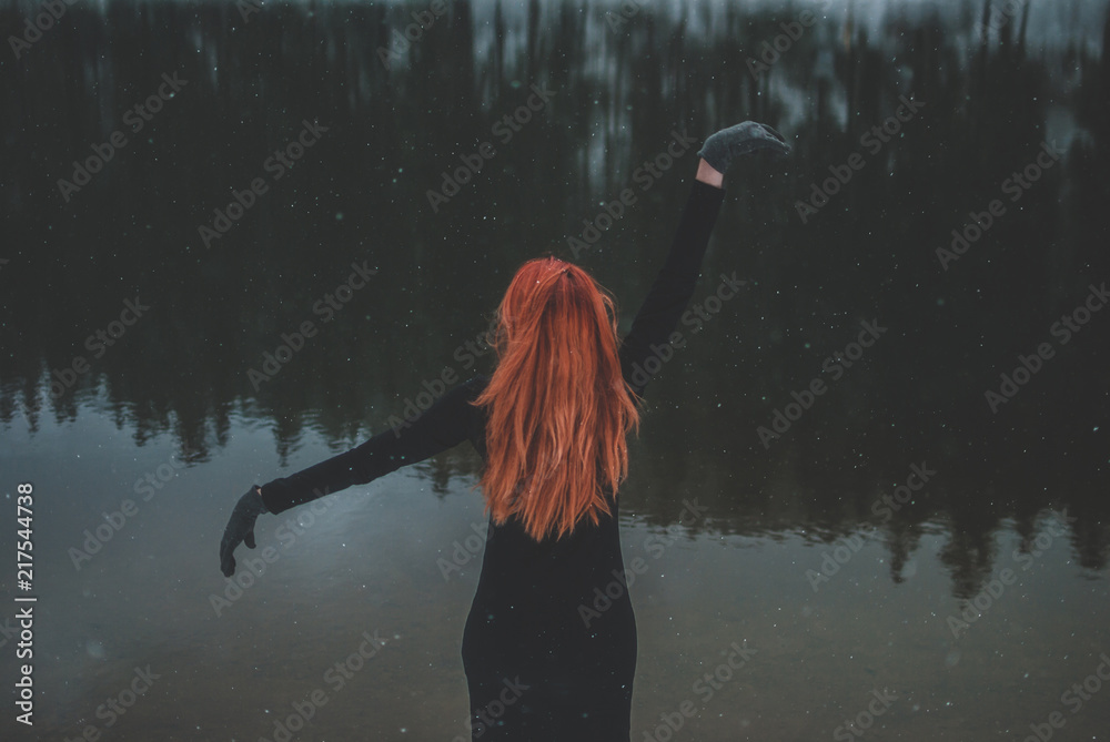 Handsome redhead girl looking in the distance. Look from behind. White ...