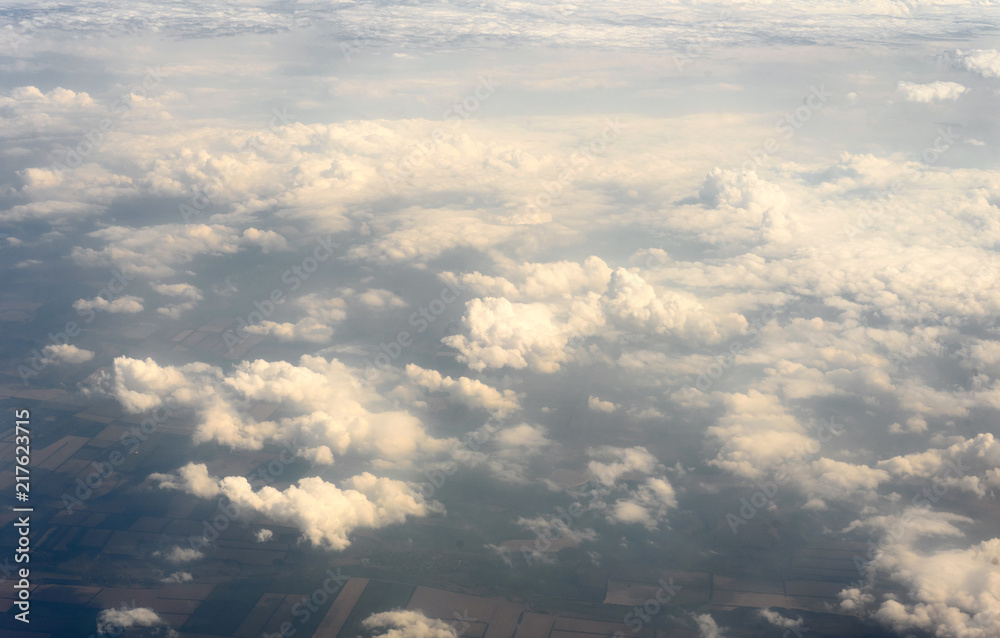 Huge cloudscape of clouds taken from an aerial position from the window ...