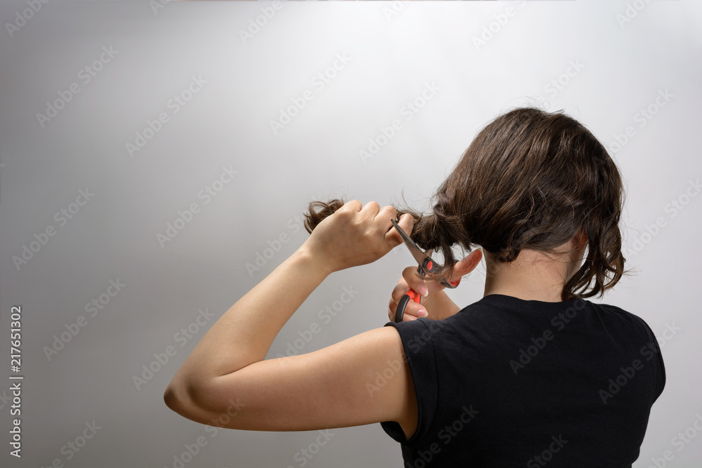 The girl is holding her braid. A frustrated woman took an angry ...