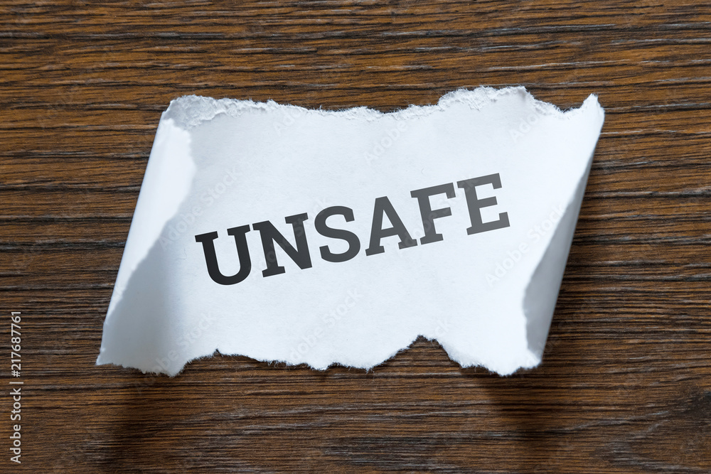 unsafe - an inscription on a piece of white paper, a scroll. The ...