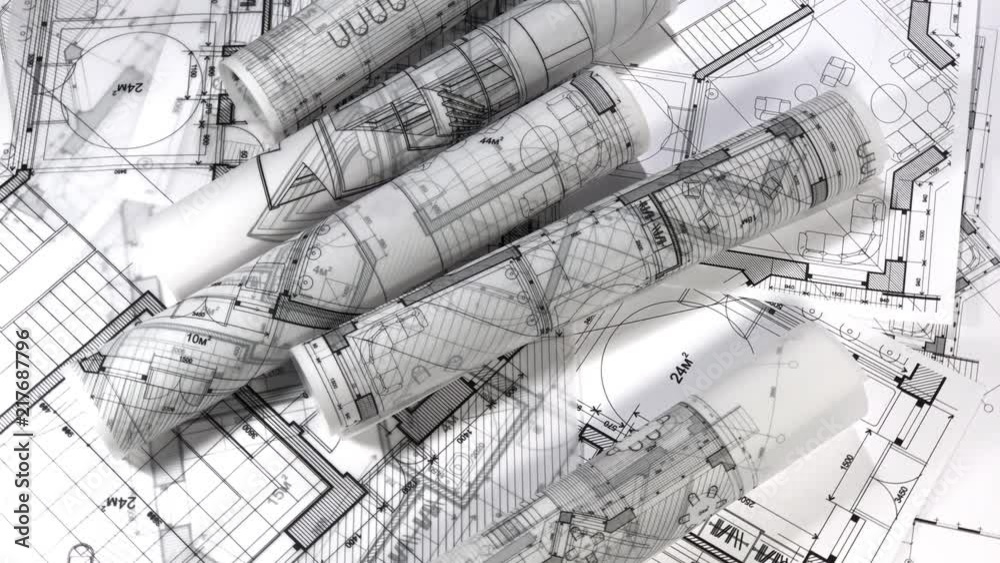 Blueprints - rolls of architectural drawings smoothly rotate on the ...