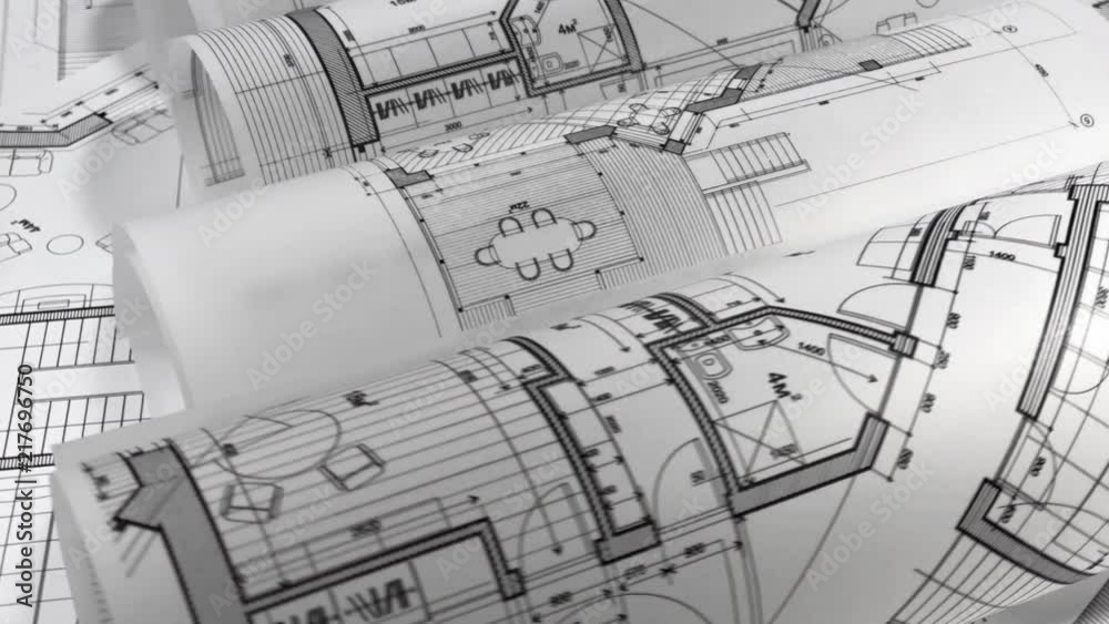 Blueprints - rolls of architectural drawings smoothly rotate on the ...
