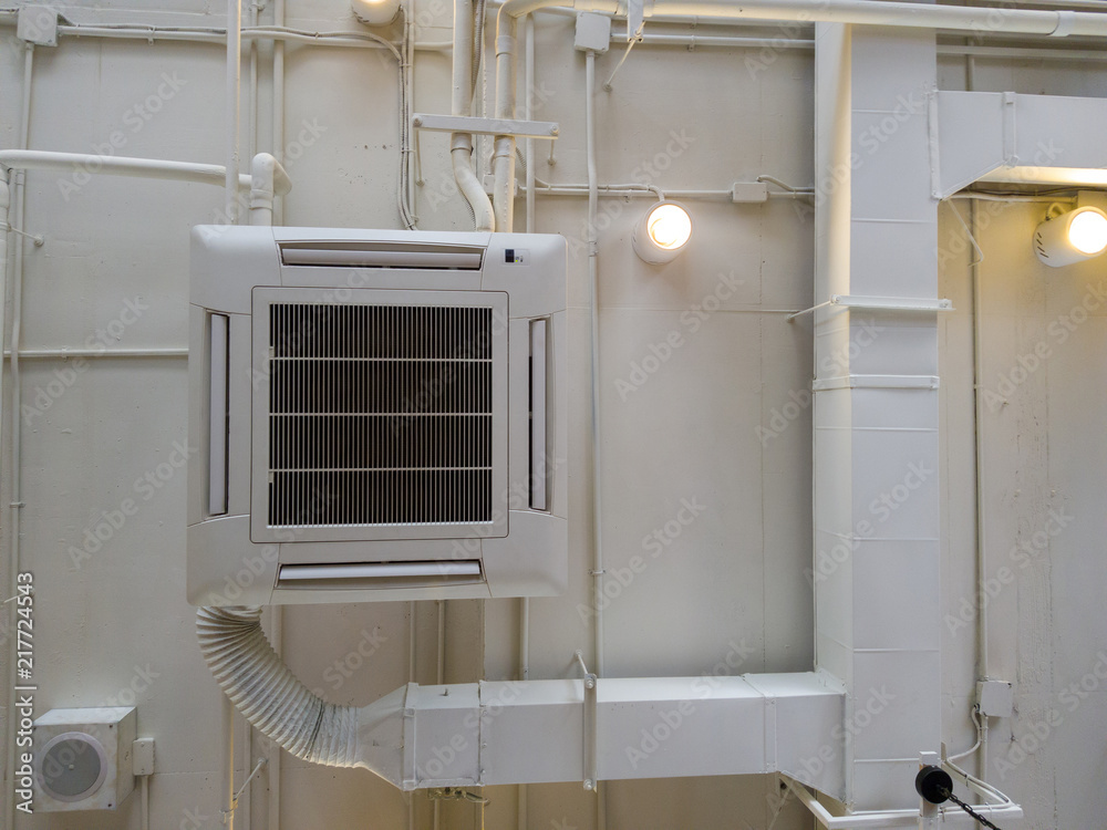 White Industrial air conditioner cooling pipe with plumbing at ceiling ...