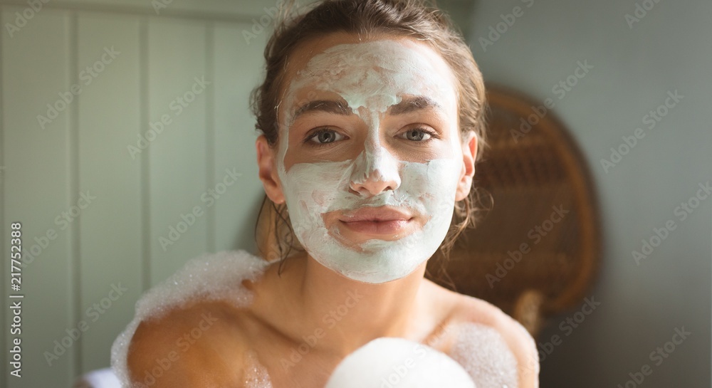 Woman with facial mask on face taking bath in bathroom Stock Photo ...