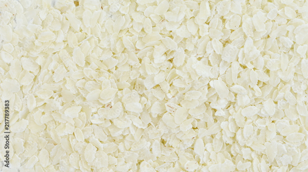 flattened rice flakes as background. Stock Photo | Adobe Stock