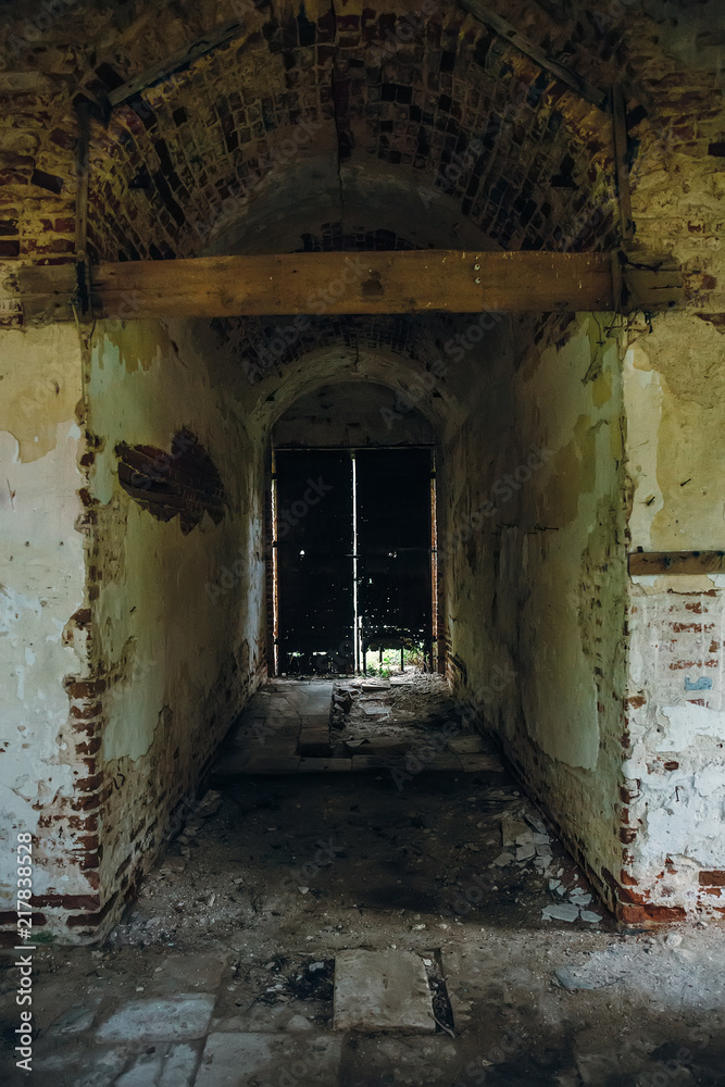 Inside ancient ruined medieval brick temple interior with arches and ...
